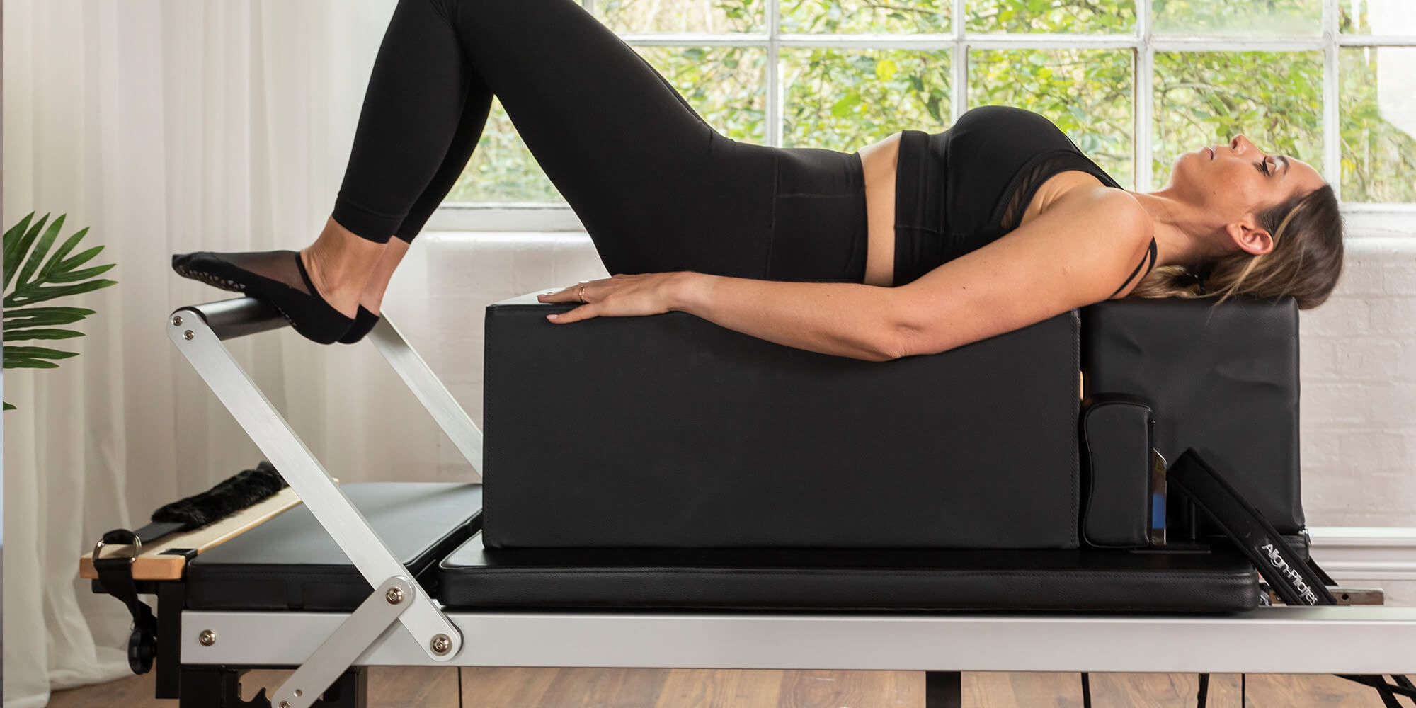 How to Use a Sitting Box for Pilates to Improve Your Alignment